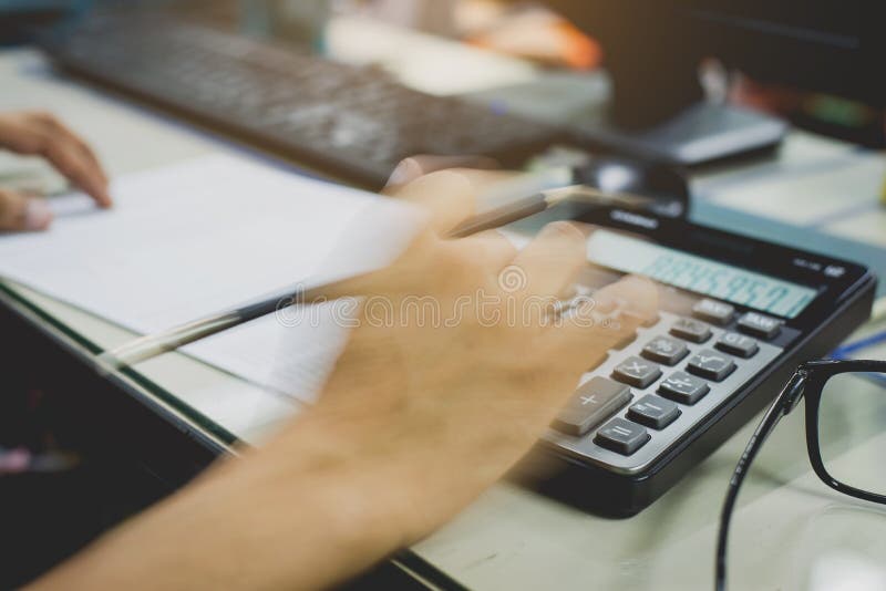 Hand Man Doing Finances and Calculate on Desk about Cost at Office ...