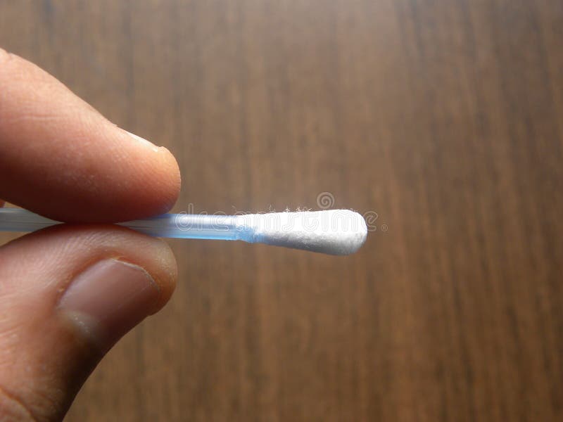 Hand holding cotton swab stock image. Image of clean - 129362505