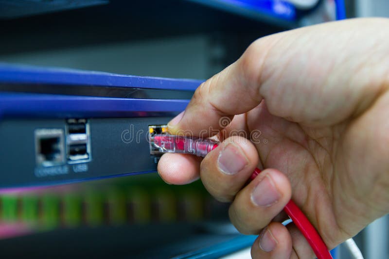 Hand of Man Holding the Network Cables To Connect SFP Module Port Stock ...