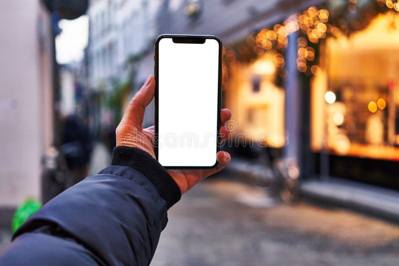 Hand of Man Holding Smartphone at Street Stock Image - Image of urban ...