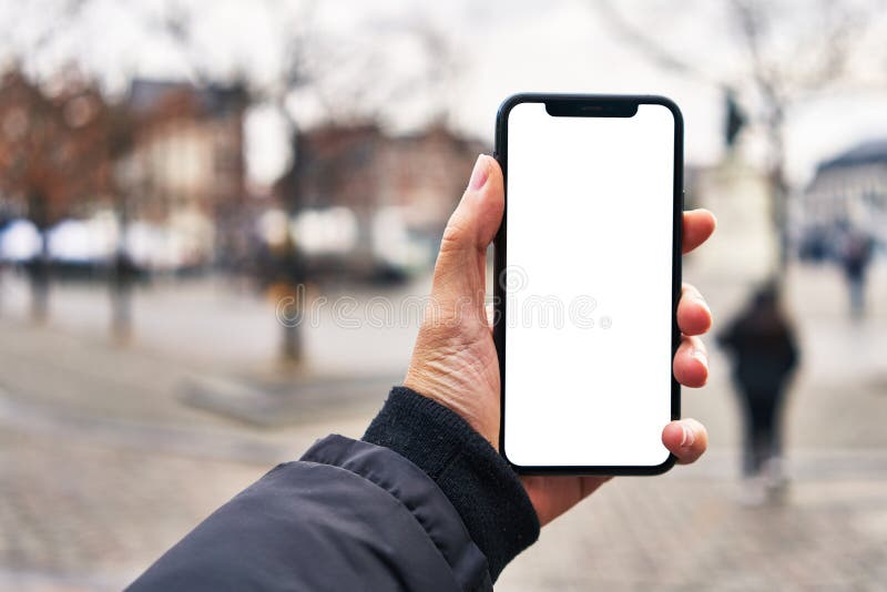 Hand of Man Holding Smartphone at Street Stock Image - Image of ...