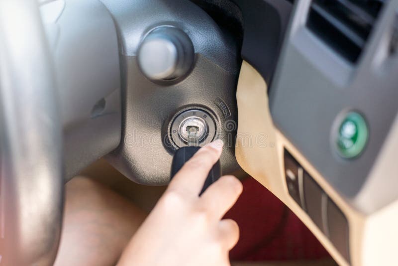 Hand of Man Inserting Key To Start Car System,Button on Dashboard in ...