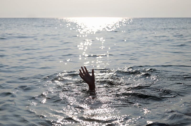 Hand of Man on the Ocean with Dramatic Toned Effect Stock Image - Image ...