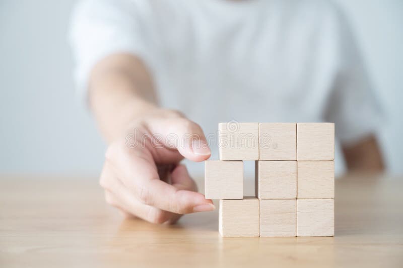 Hand of a Man Picked Wood Blocks from the Group Stock Photo - Image of ...