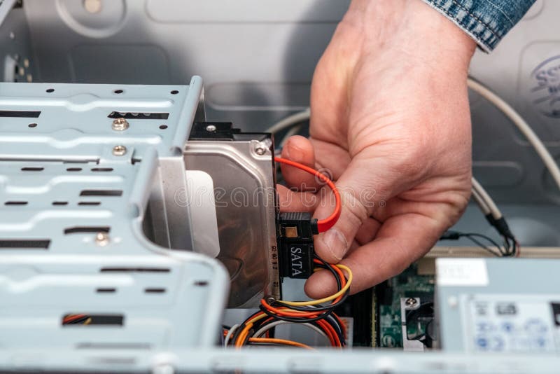 Hand of Man Plugging SATA Serial at Attachment, Serial ATA Data Cable ...