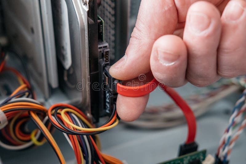 Hand of Man Plugging SATA Serial at Attachment, Serial ATA Data Cable ...