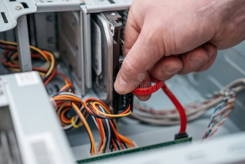 Hand of Man Plugging SATA Serial at Attachment, Serial ATA Data Cable ...
