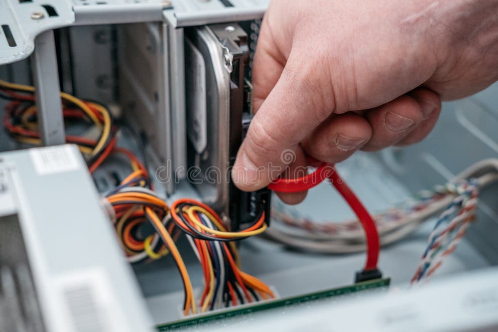 Hand of Man Plugging SATA Serial at Attachment, Serial ATA Data Cable ...