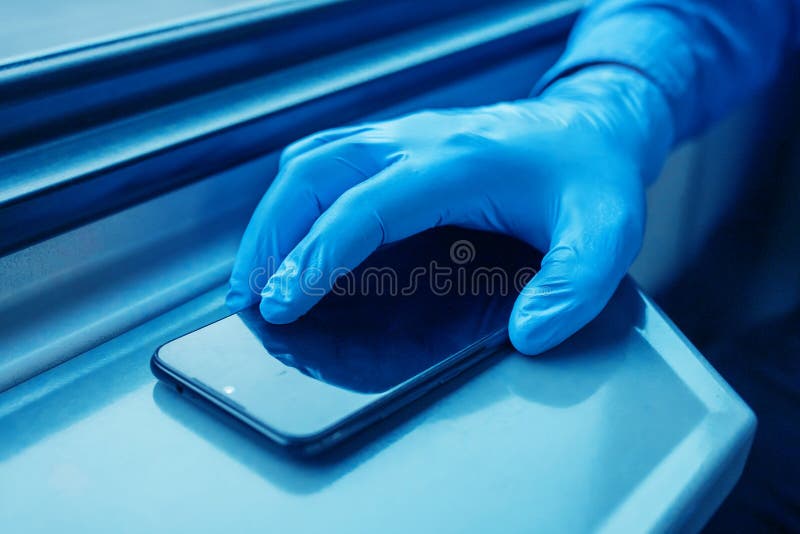 The Hand of a Man in Protective Medical Gloves Take a Mobile Phone ...