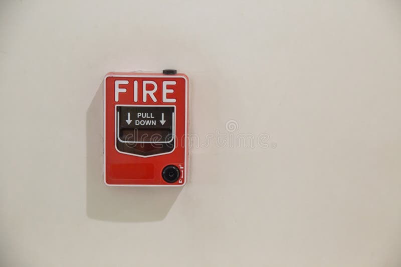 Hand of Man Pulling Fire Alarm Switch on the White Wall As Background ...