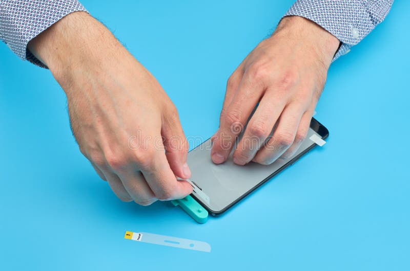 The Man Replacing the Broken Tempered Glass Screen Protector for ...