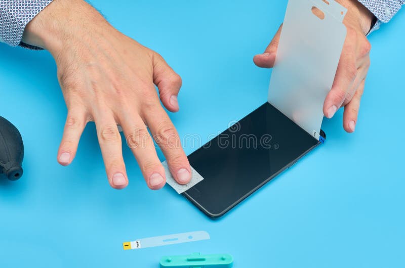 The Man Replacing the Broken Tempered Glass Screen Protector for ...