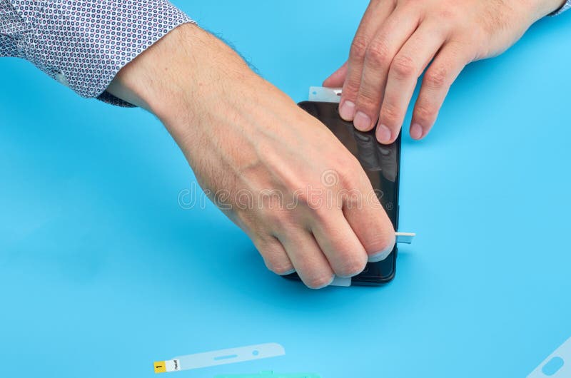 The Man Replacing the Broken Tempered Glass Screen Protector for ...