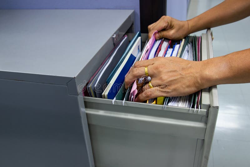 Hand of Man Search Files Document in a File Cabinet in Work Office ...