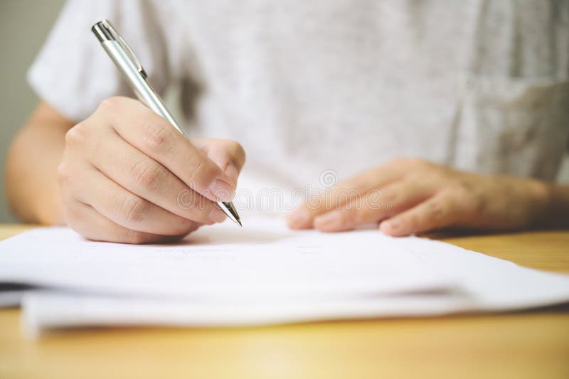 Hand of Man Signing Signature Filling in Application Form Document ...