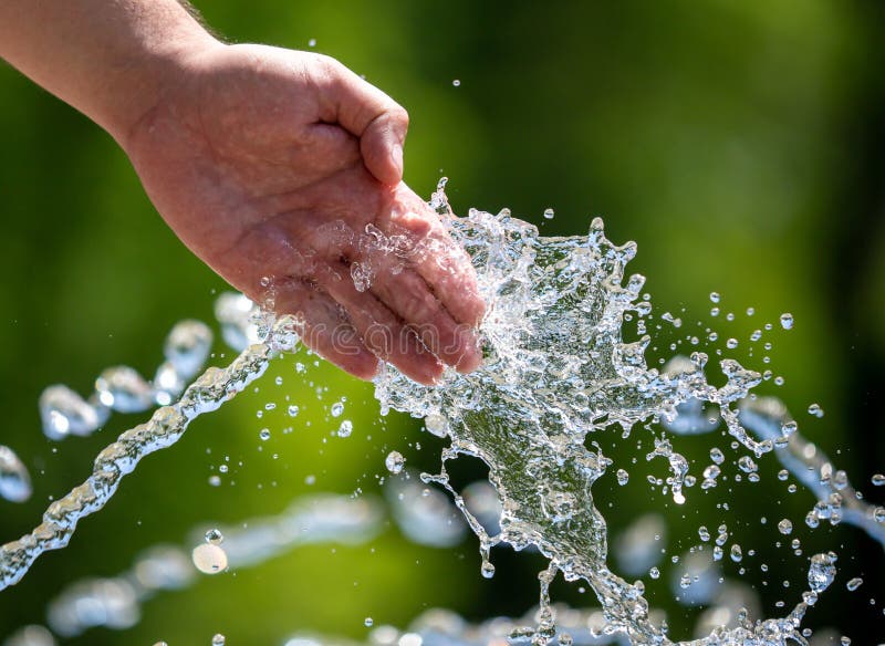 Hand of a Man in the Spray of Water of the Fountain Stock Image - Image ...