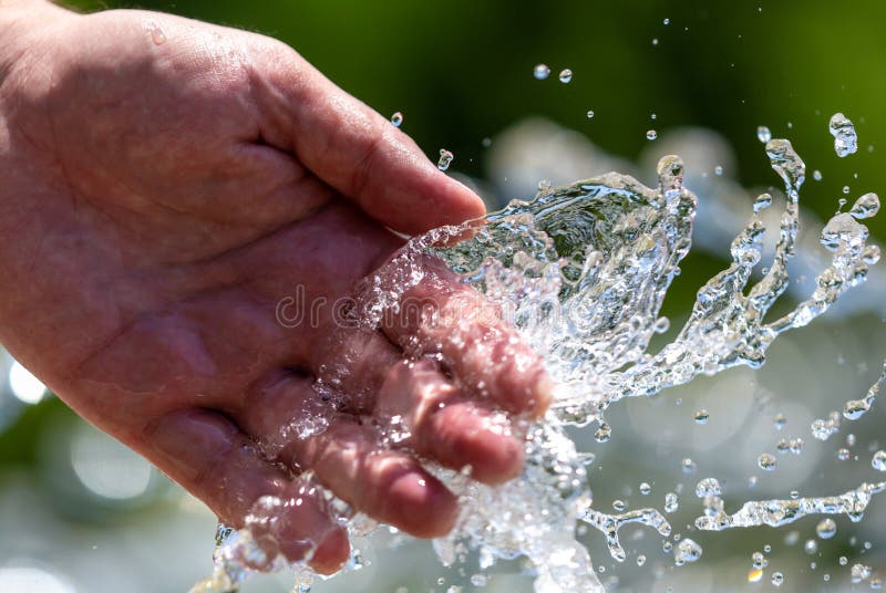 Hand of a Man in the Spray of Water of the Fountain Stock Photo - Image ...