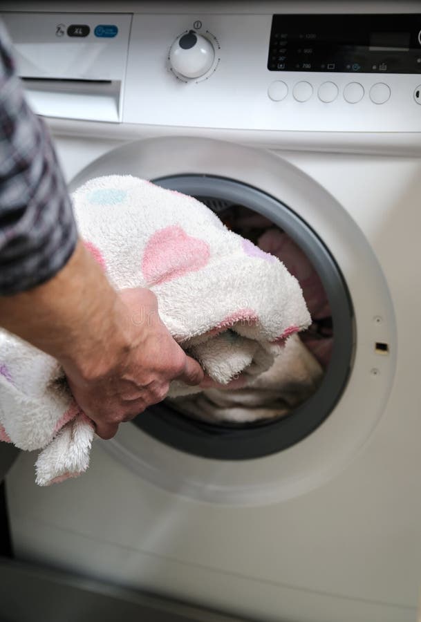 Hand Man Takes Things with the Washing Machine. Stock Image - Image of ...