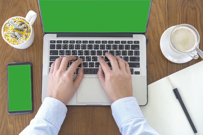 Hand of Man Using Computer Laptop and Smartphone with Notebook for ...