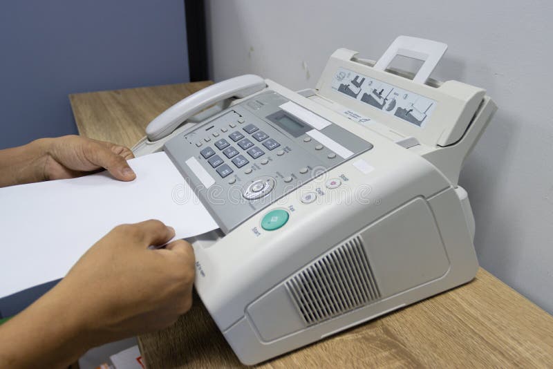 Hand Man Are Using A Fax Machine Send Paper In The Office Stock Photo ...