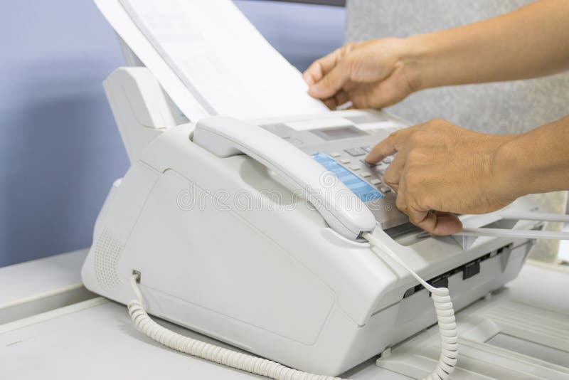 Hand Man are Using a Fax Machine Send Paper in the Office Stock Photo ...