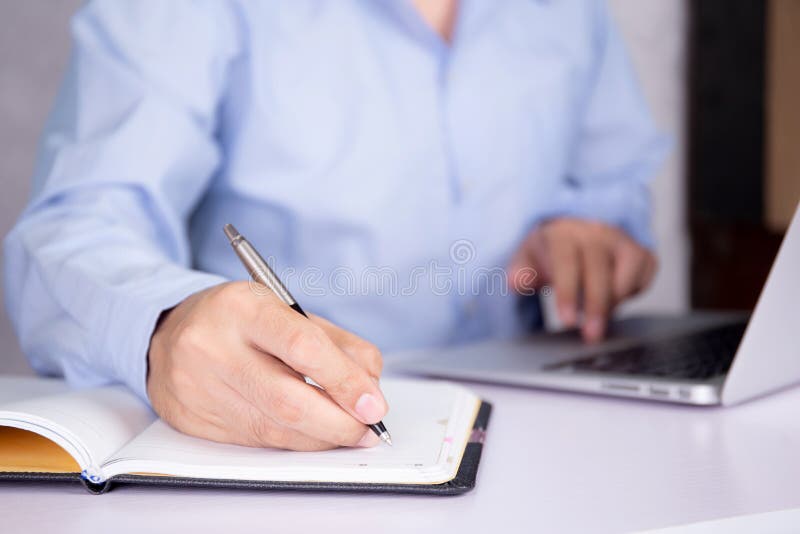 Hand of Man Watching Webinar on Laptop Computer and Writing on Notebook ...