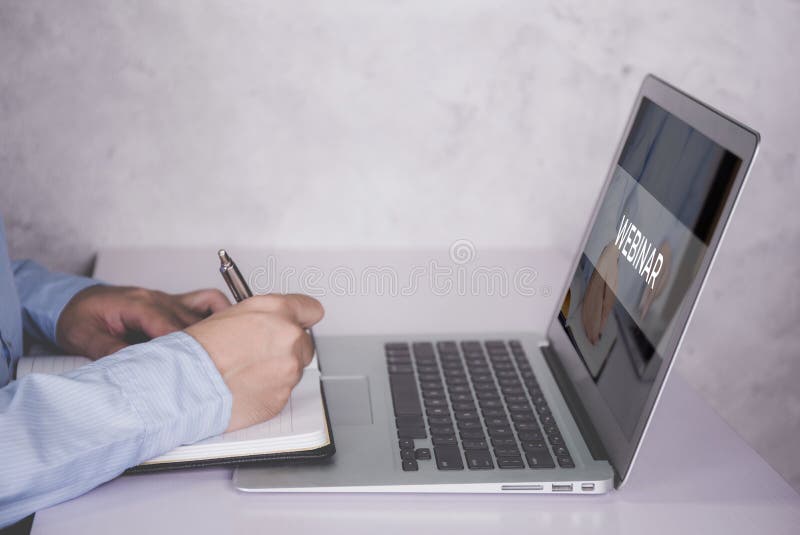 Hand of Man Watching Webinar on Laptop Computer and Writing on Notebook ...
