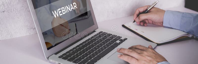 Hand of Man Watching Webinar on Laptop Computer and Writing on Notebook ...
