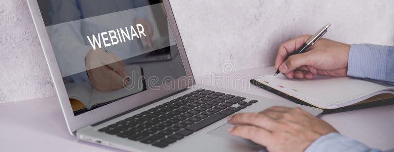 Hand of Man Watching Webinar on Laptop Computer and Writing on Notebook ...