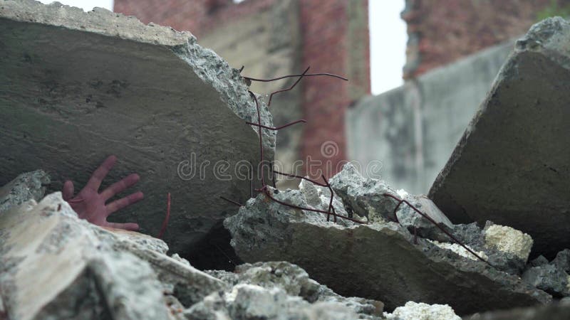 Hand of a Man Who Crashed a House. Pressed by a Reinforced Concrete ...
