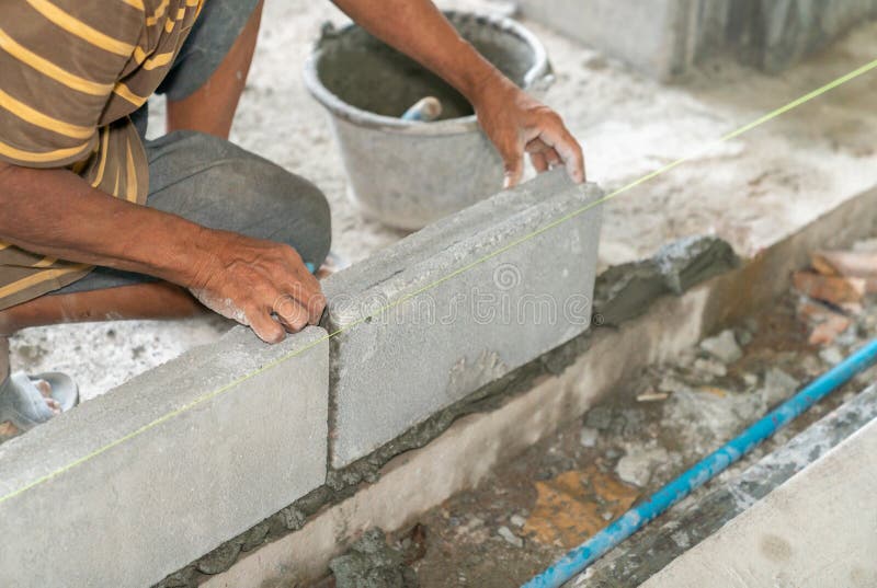 Hand of Mansonry Install Concrete Brick for Wall of Building Stock ...