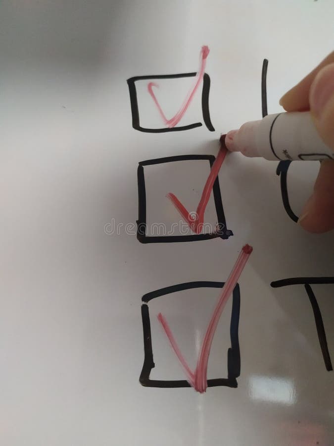 A Hand with a Marker Puts a Check Mark Stock Image - Image of table ...