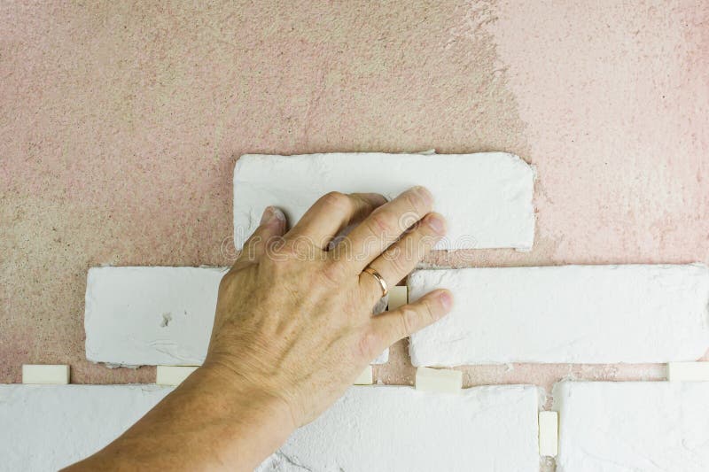 447 Hand Puts Brick Stock Photos - Free & Royalty-Free Stock Photos ...