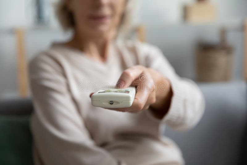 Hand of Mature Lady Operating Remote Controller Stock Image - Image of ...