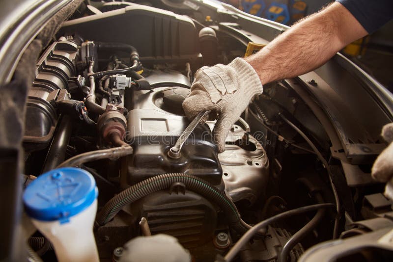Hand of Mechanic while Fixing Engine Stock Photo - Image of fixing ...