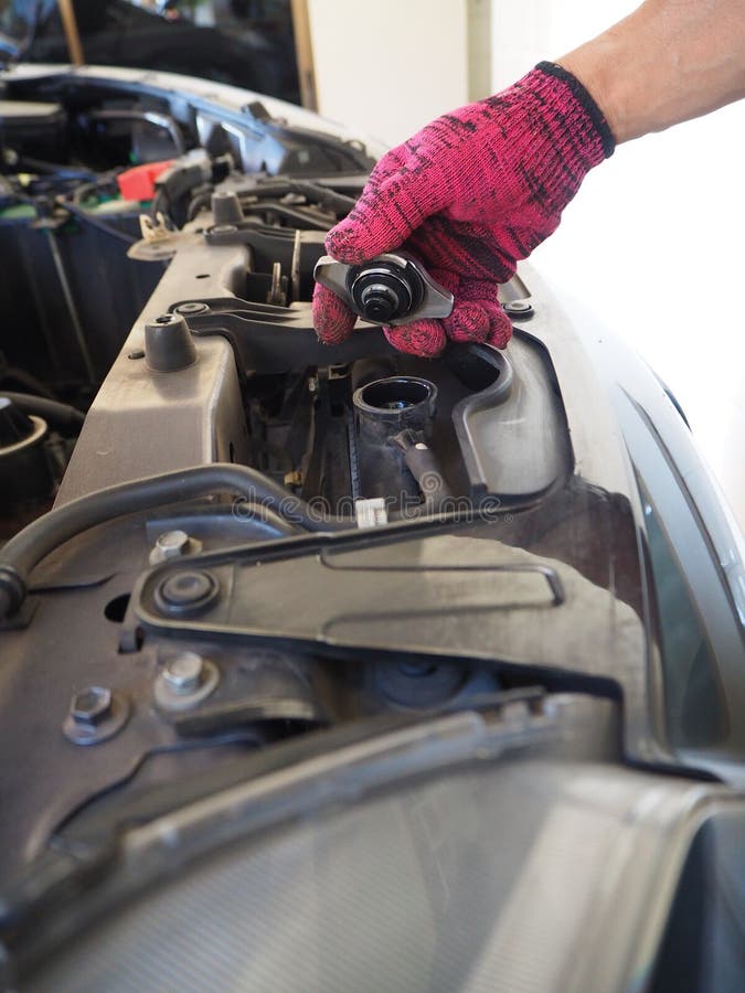Hand of Mechanic Man with the Engine Service or Repair in an Automotive ...