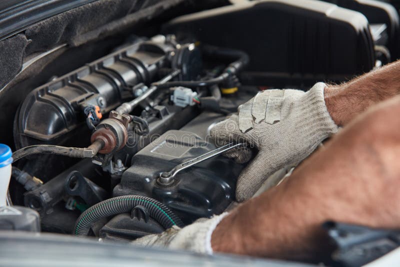 Hand of Mechanic with Tool at Auto Repair Stock Photo - Image of ...