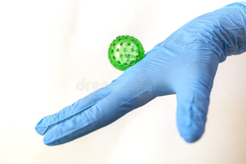 Hand in Medical Gloves with a Virus Stuck on the Hand Stock Photo ...