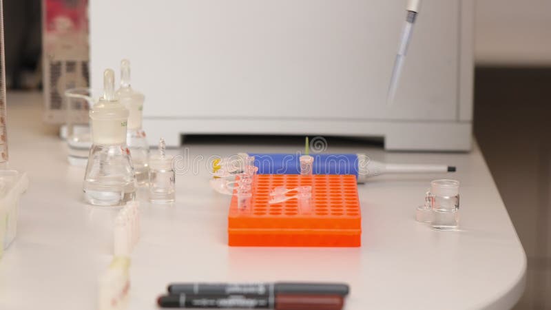 Hand Drawing Liquid in Pipette and Adding To Test Tubes Stock Footage ...