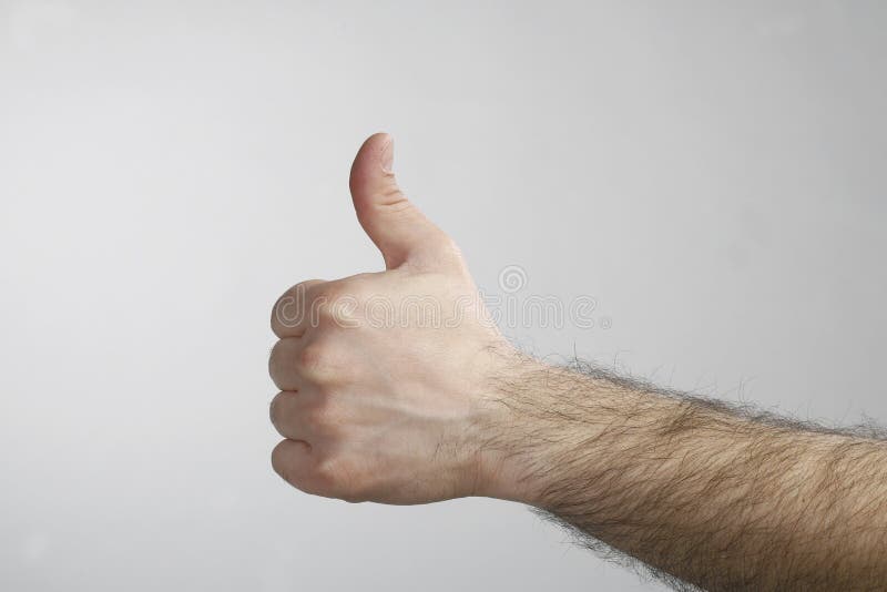 De Echte Hand Van Duimen Ondertekent Omhoog Op Witte Achtergrond Stock ...