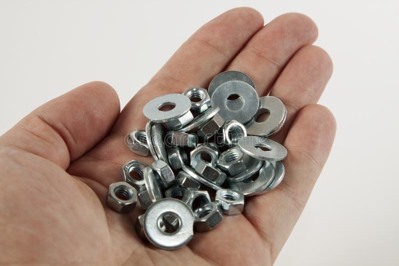 Hand with metal nuts stock photo. Image of store, small - 95698576