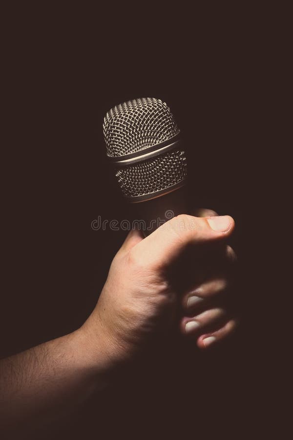 Hand and microphone stock image. Image of metal, hand - 29191377