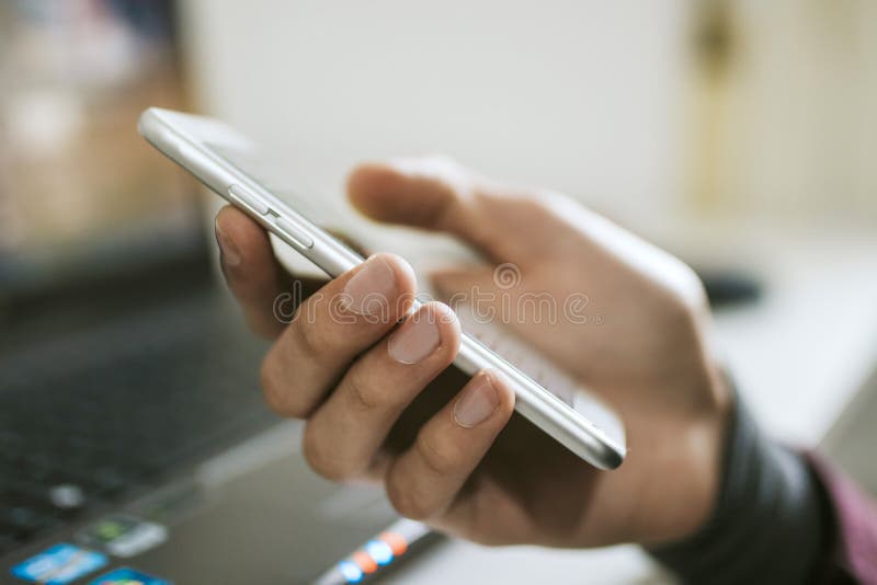 Hand with mobile phone stock photo. Image of chatting - 97243164