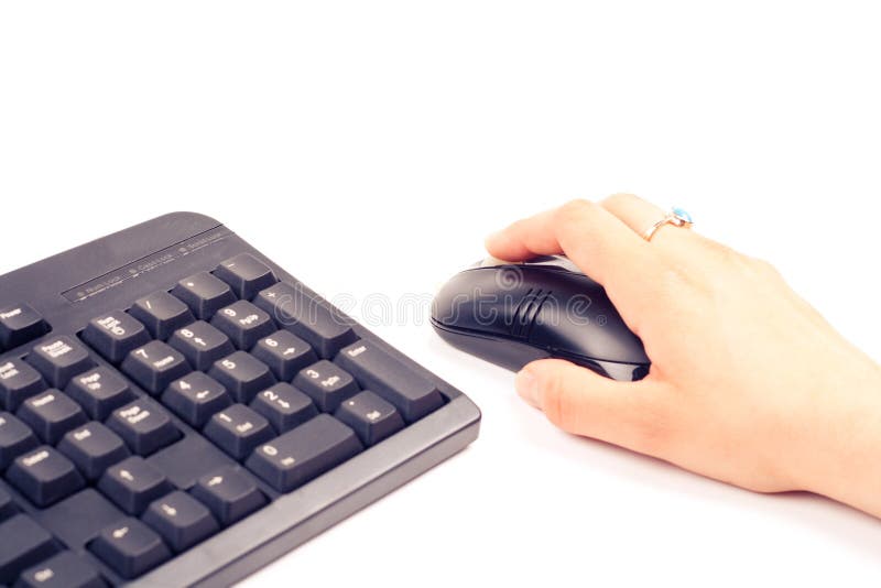 Hand on Mouse and Laptop Keyboard in the Back, Blured Stock Image ...