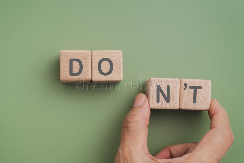 Hand Move Wood Cube Blocks with NT Text on Green Background. for Do S ...