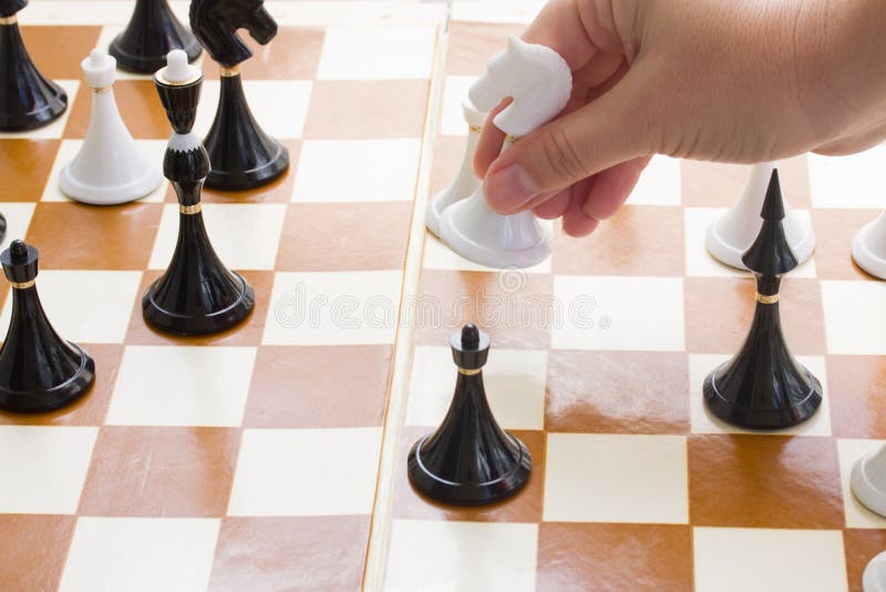 Hand moving chess knight stock image. Image of strategic - 39232719
