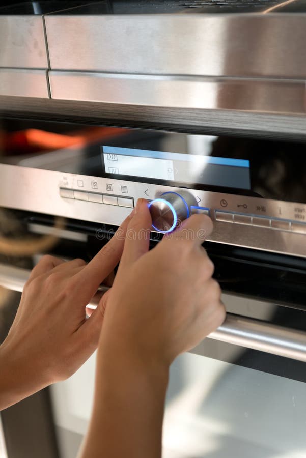 Hand moving the timer knob stock image. Image of equipment - 34030973