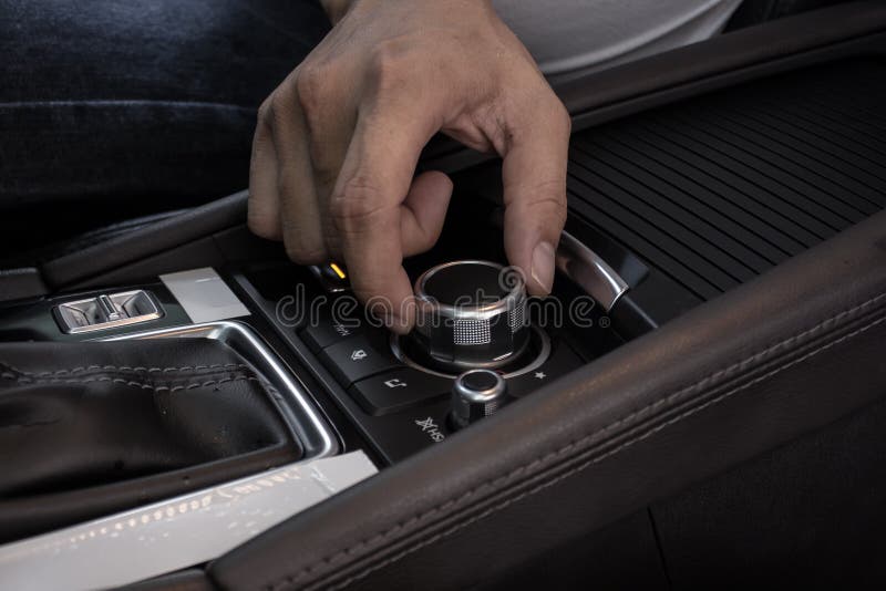 Hand on Multimedia Control Buttons of a Modern Car Stock Photo - Image ...