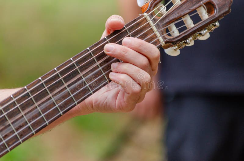 Hand of a Musician Playing a Guitar Stock Image - Image of classroom ...