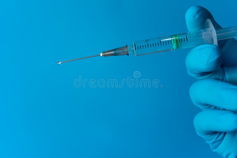 A Hand with a Nitrile Glove Appears on the Right Side of the Image ...